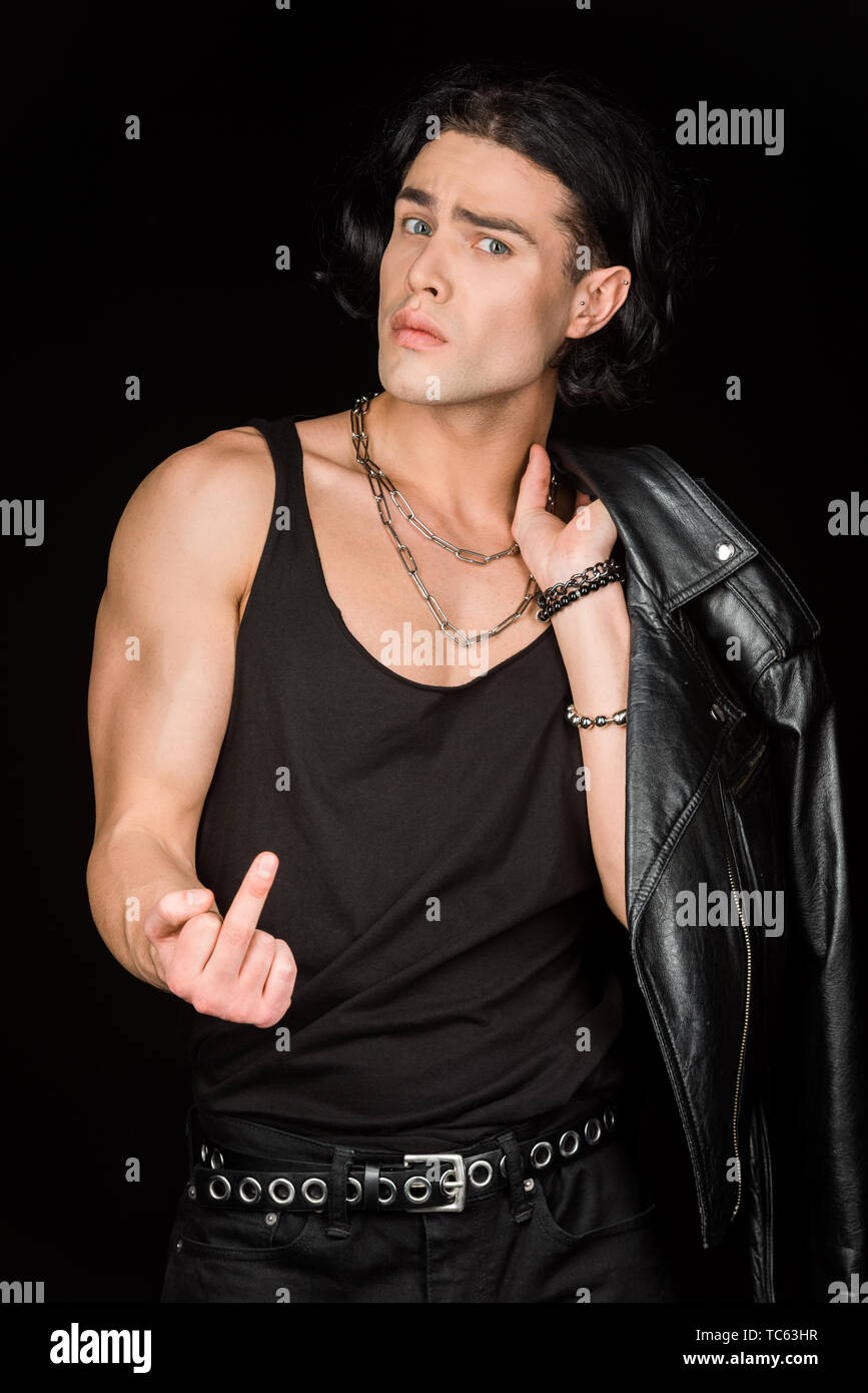 handsome man showing middle finger and holding leather jacket isolated ...
