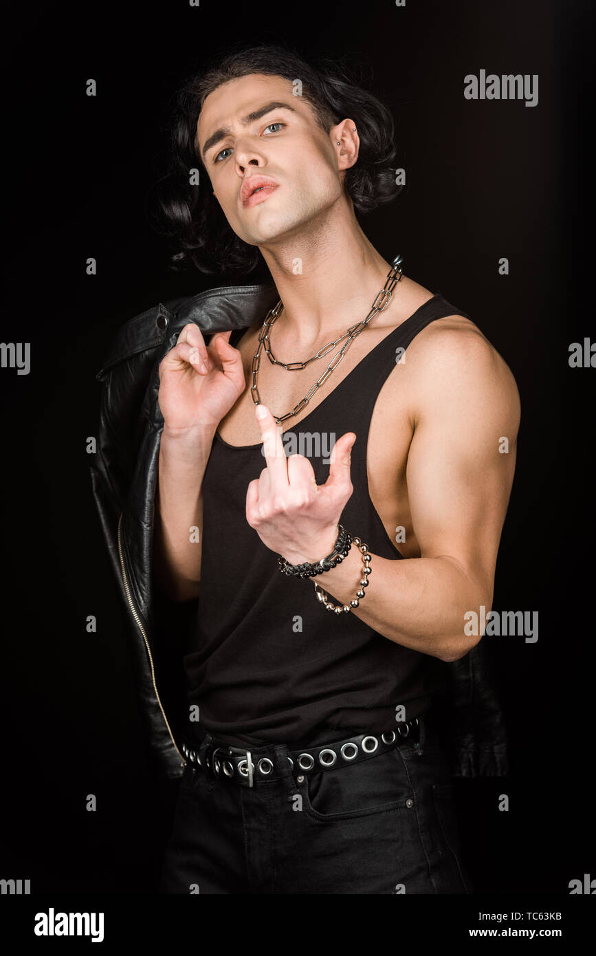 handsome man showing middle finger while holding leather jacket ...