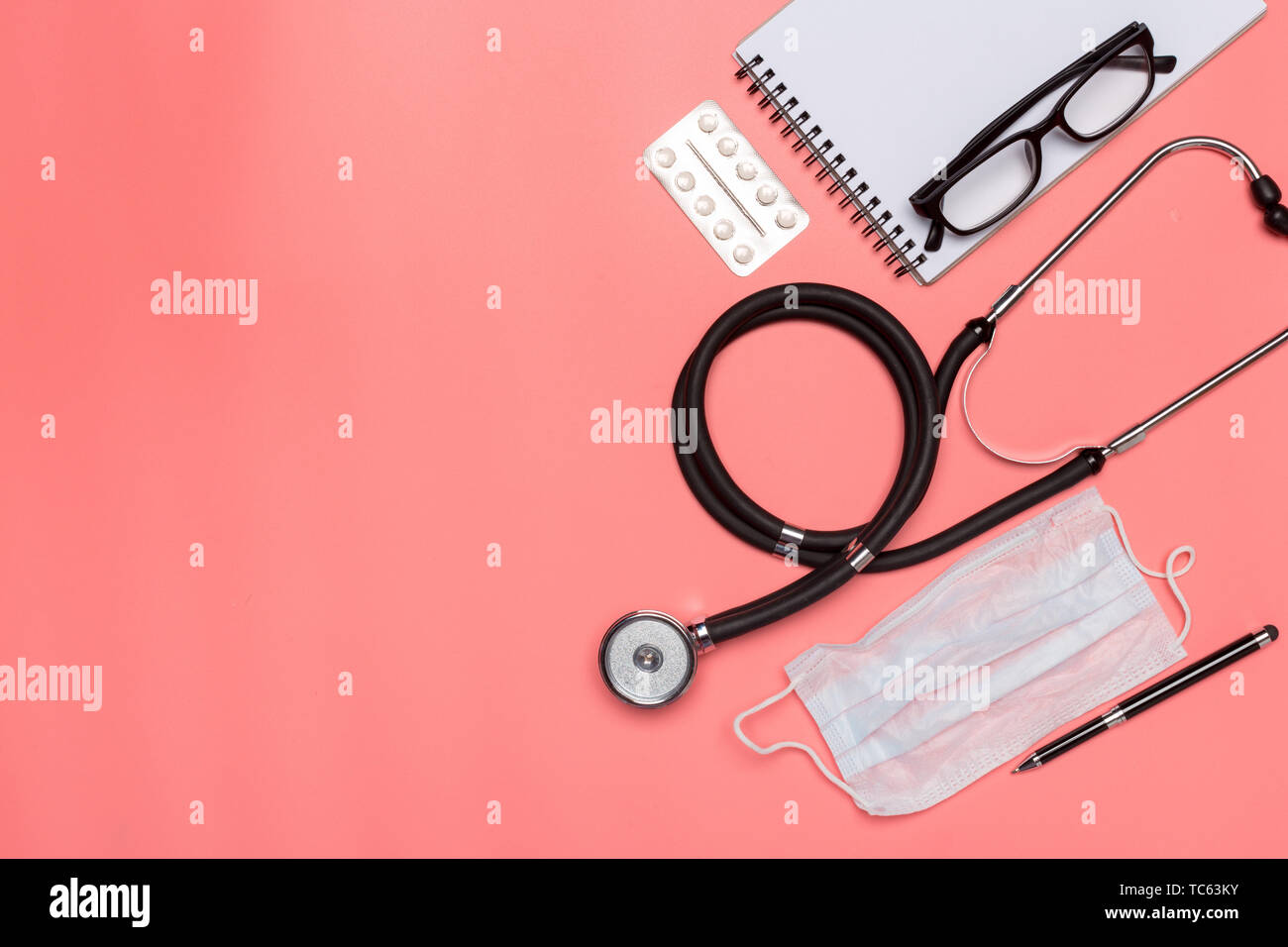 Medical equipment on a pink pastel background Stock Photo - Alamy