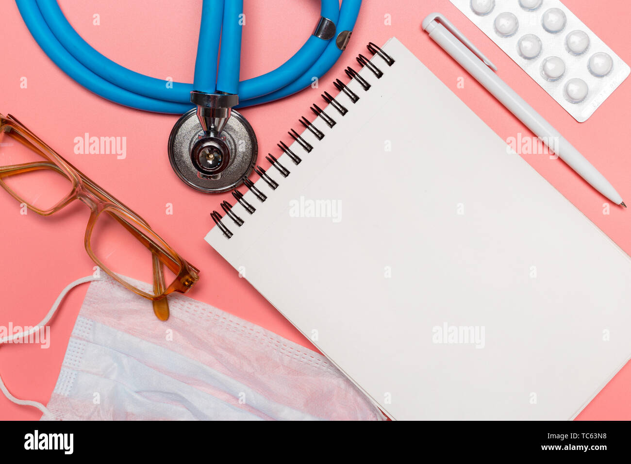Medical equipment on a pink pastel background Stock Photo - Alamy