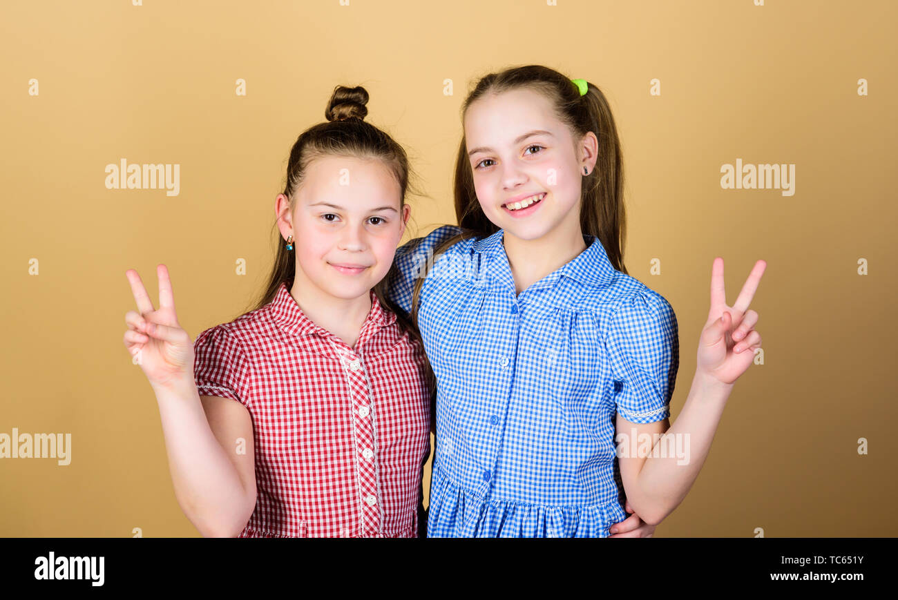 Peace begins with you. Cute small children gesturing V signs for peace ...