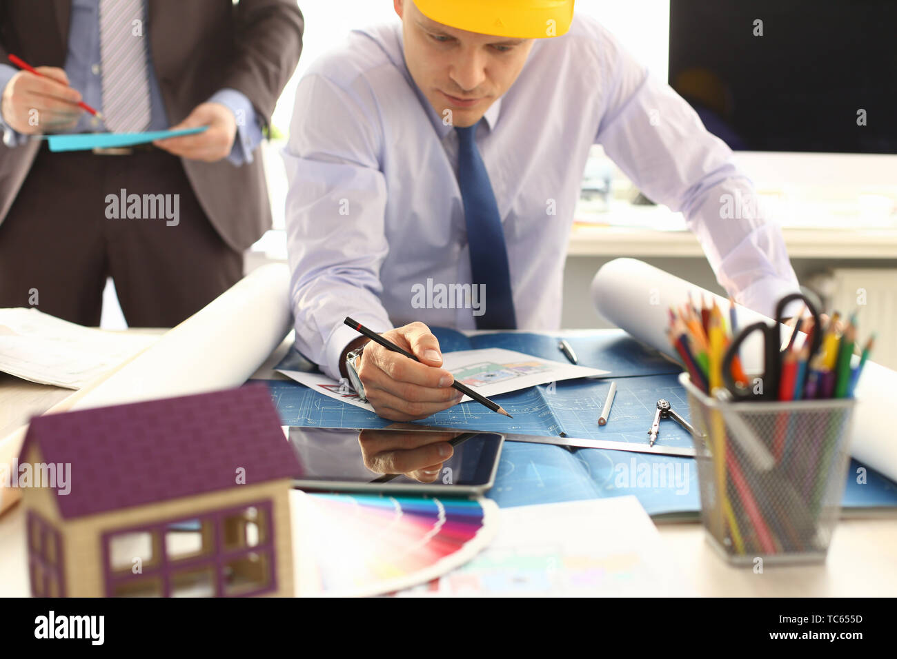 Male Architector Working on Construction Project Stock Photo - Alamy