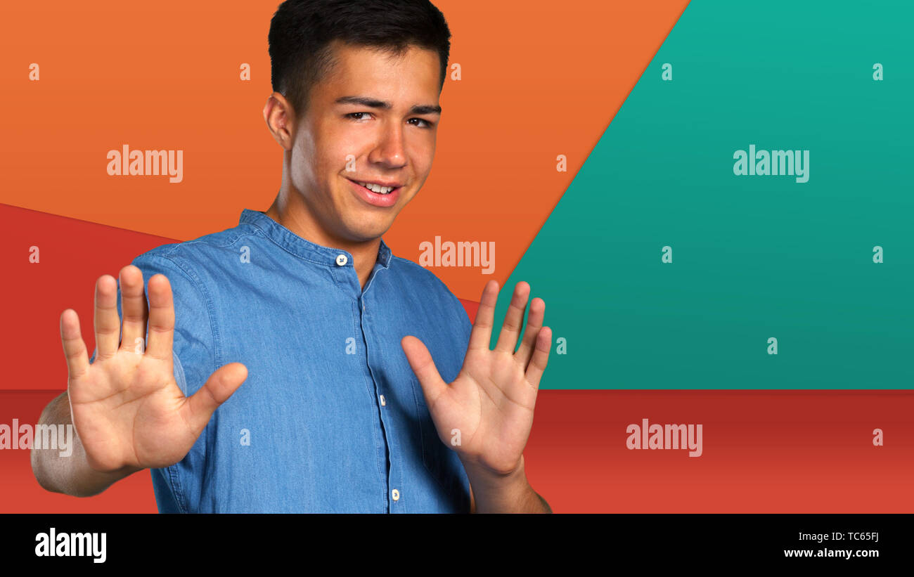 Handsome man making stop sign Stock Photo - Alamy