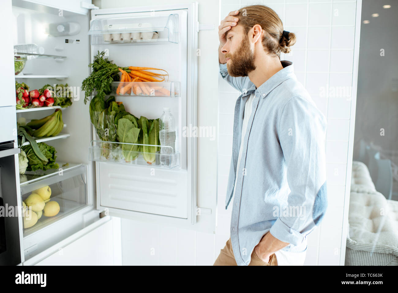 Sad man choosing products hi-res stock photography and images - Alamy