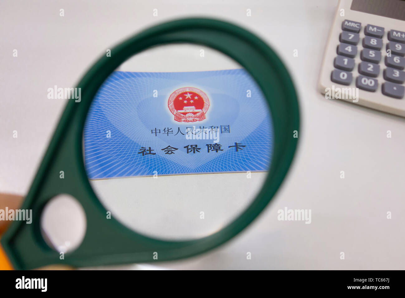 Social security card under a magnifying glass Stock Photo - Alamy