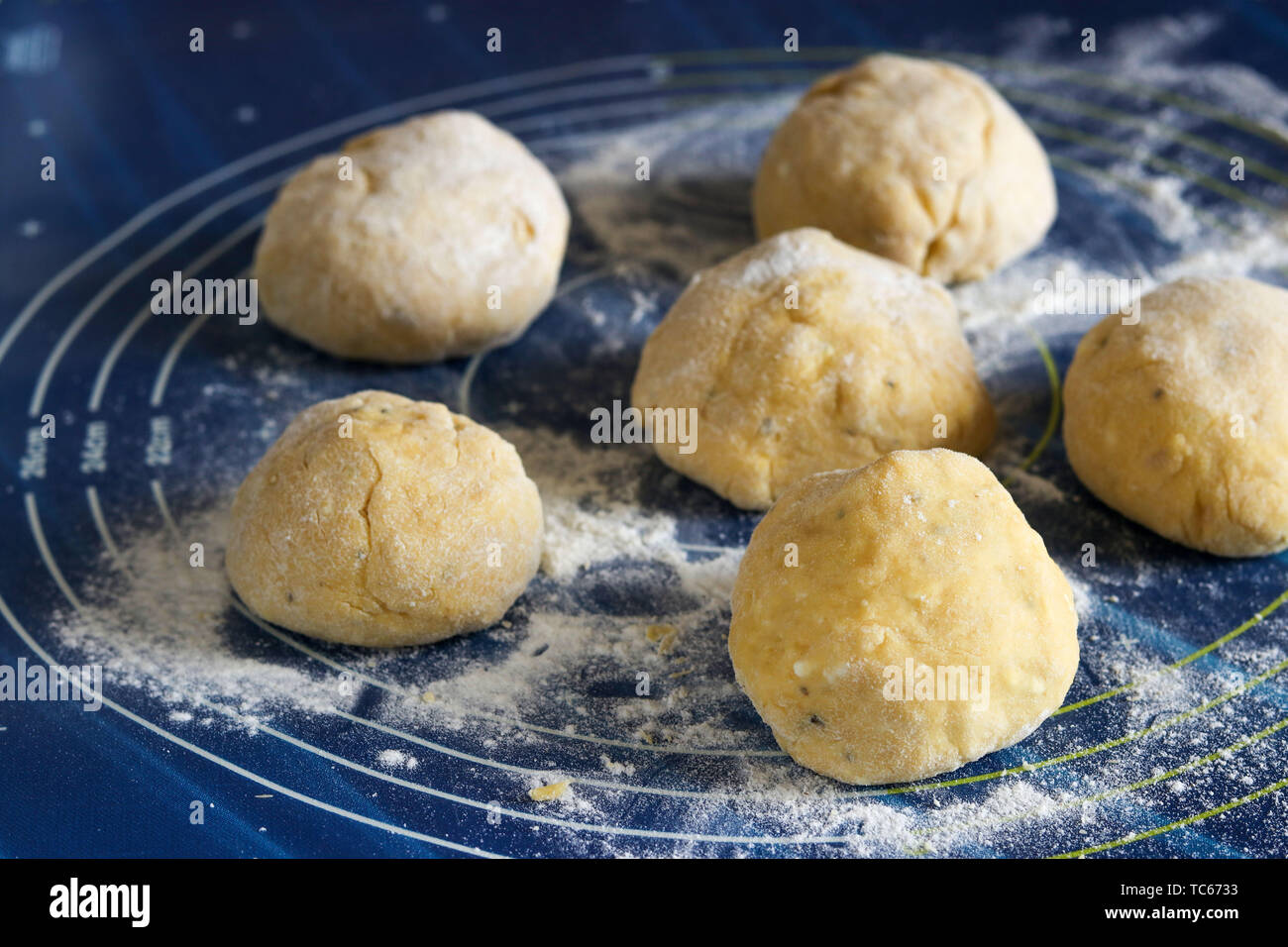The process of making bread: the dough is divided into 6 parts ...