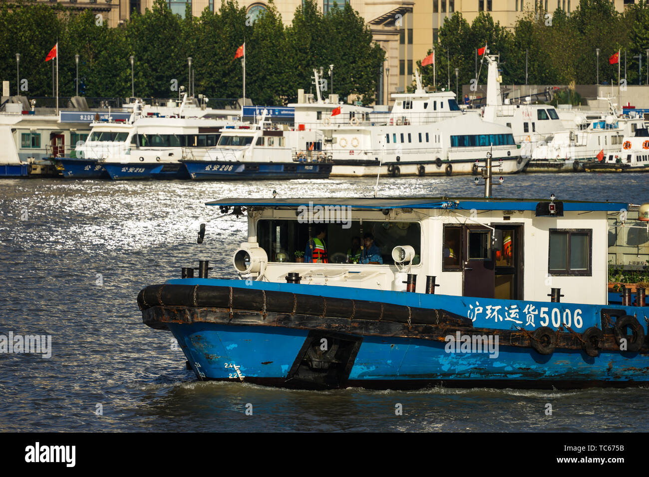 A domestic waste container sanitation ship drives on the surface of the ...