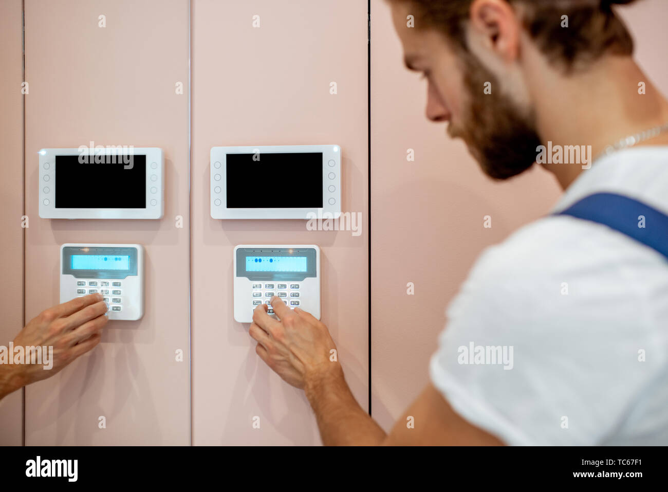 Person setting home alarm hi-res stock photography and images - Alamy