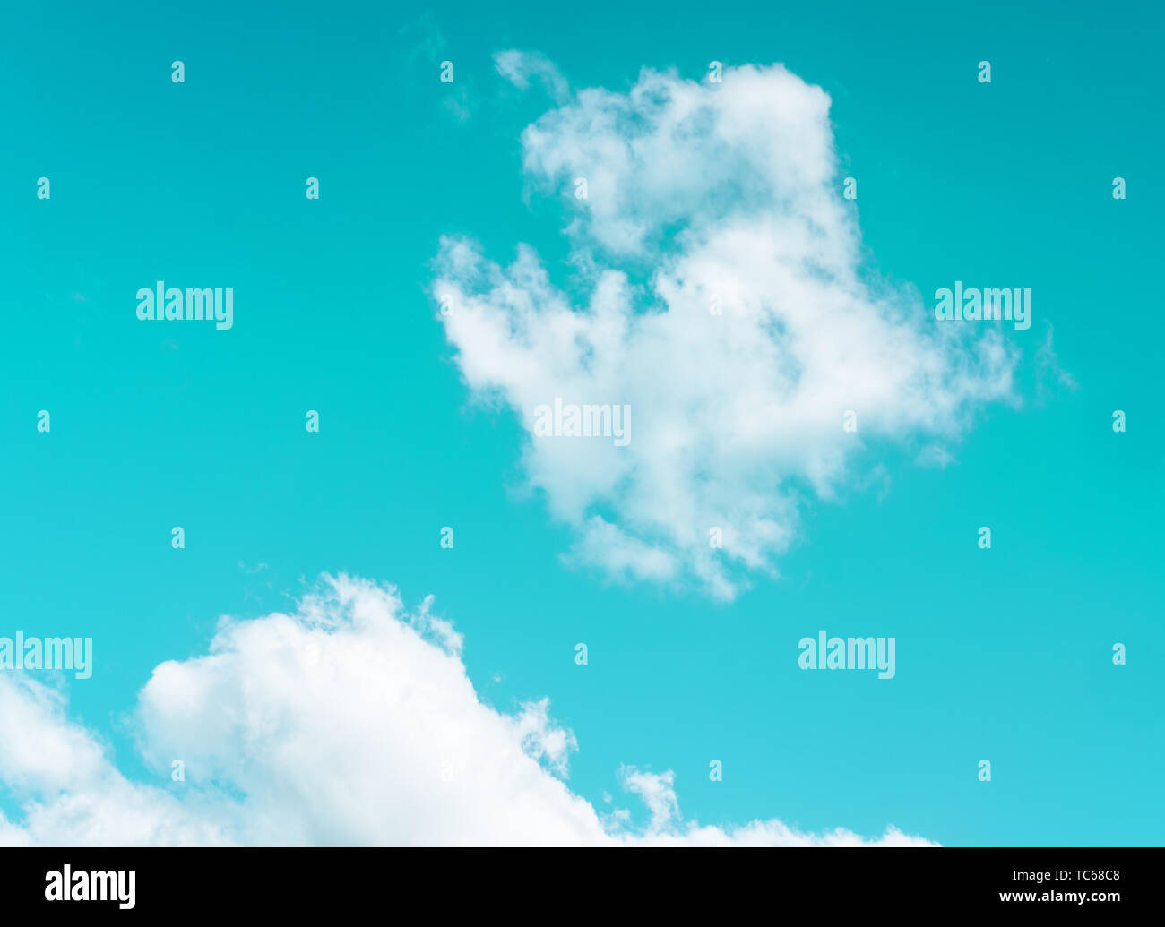 Green pop sky with white clouds. Great background Stock Photo - Alamy