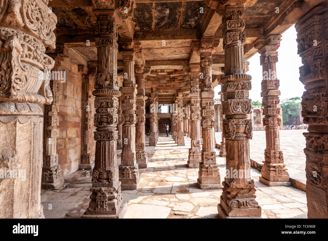 Intricate stone carvings on the cloister columns at Quwwat ul-Islam ...