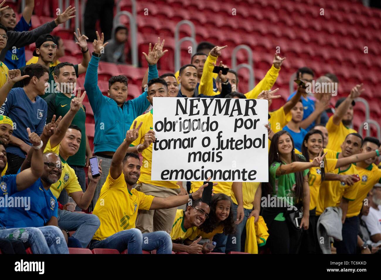 Brasilia, Brazil. 5th June, 2019. Fans pose for photos with a board ...