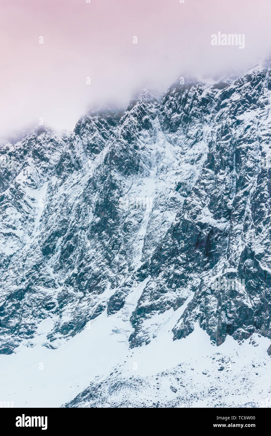 Mountain ridge covered with snow, winter in mountain valley Stock Photo ...