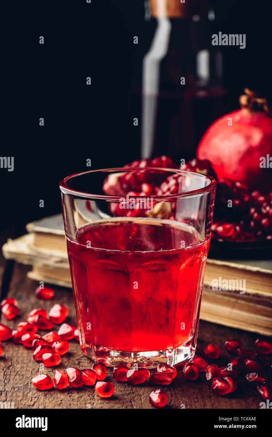 Drinking glass of pomegranate cocktail with fresh fruit Stock Photo - Alamy