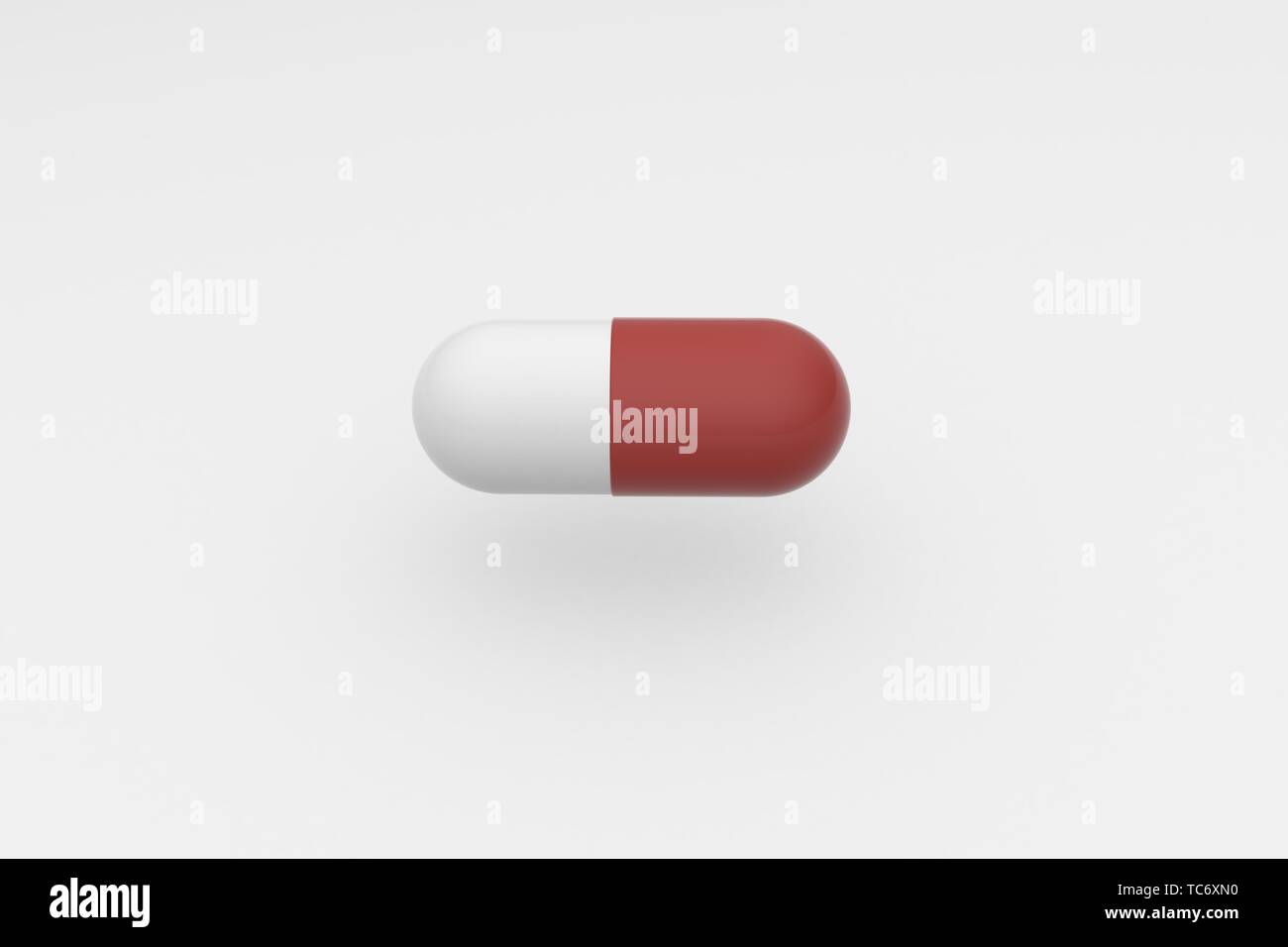 Single red white tablet on a white background. Antibiotic in the ...