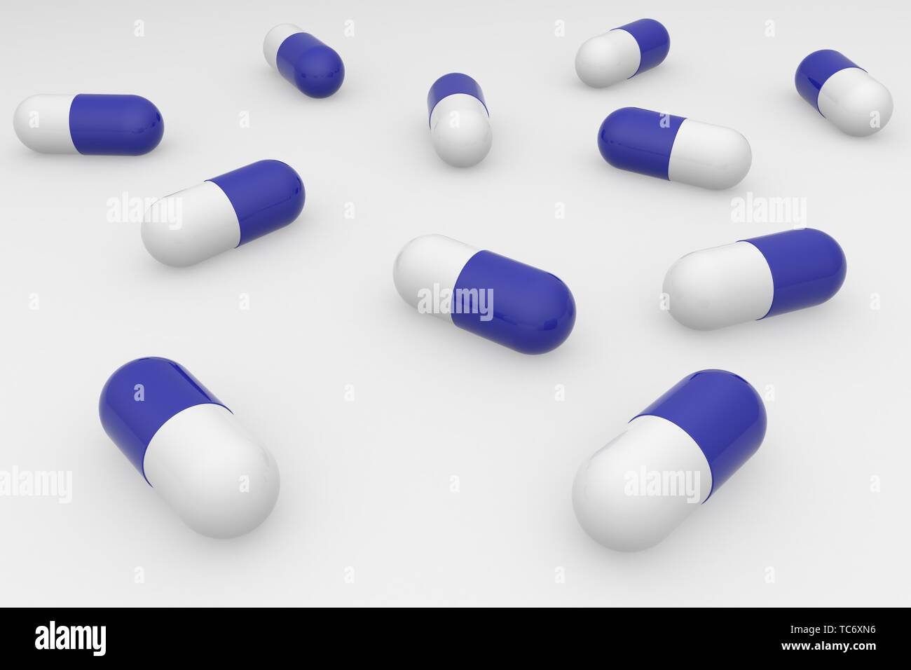 A group of blue white pills on a white background. Antibiotics in the ...