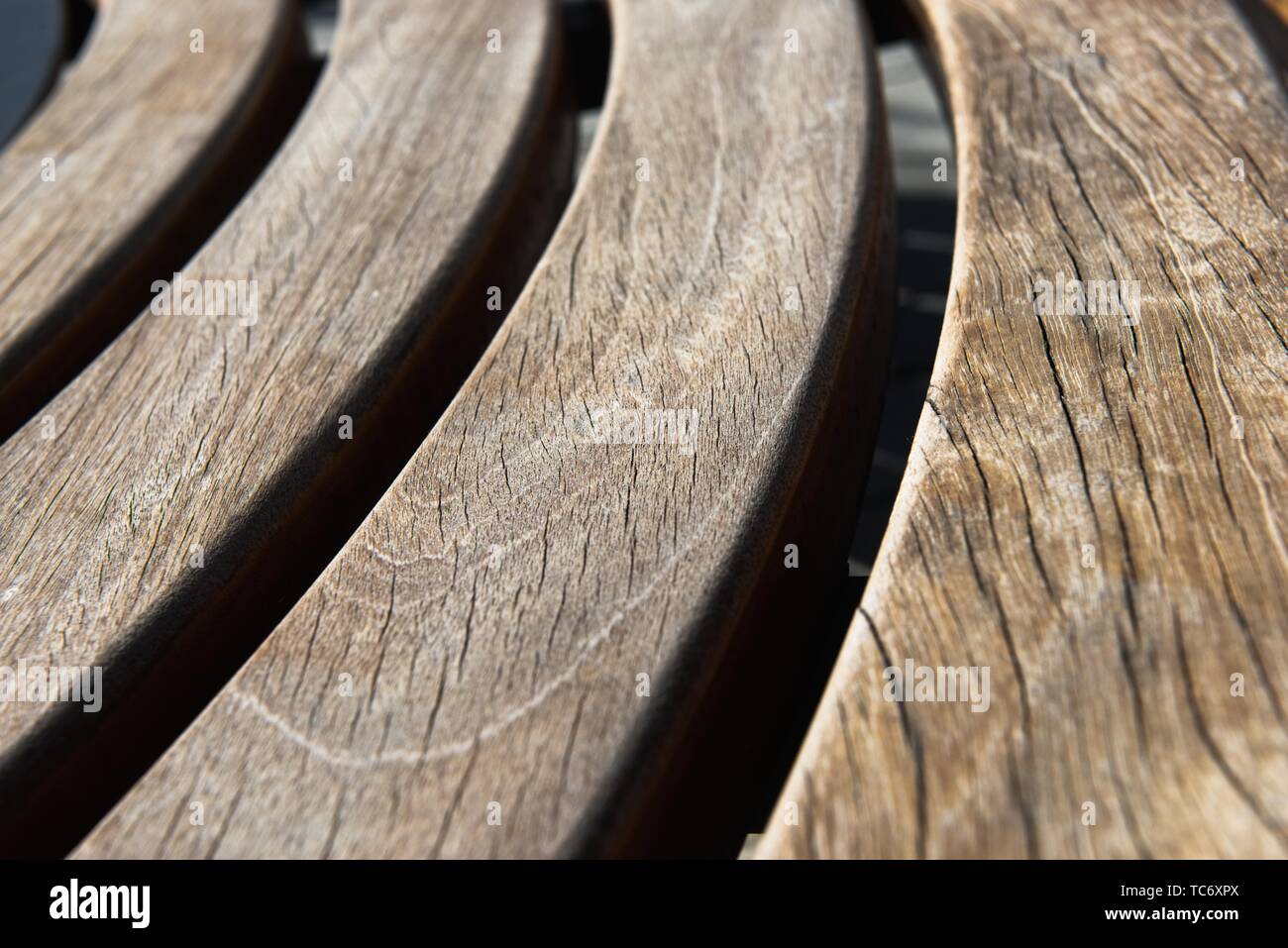 Wooden modern trendy design round circular park bench Stock Photo - Alamy