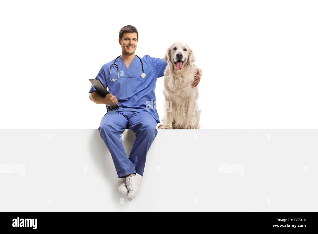 Full length portrait of a veterinarian in a blue uniform sitting on a ...