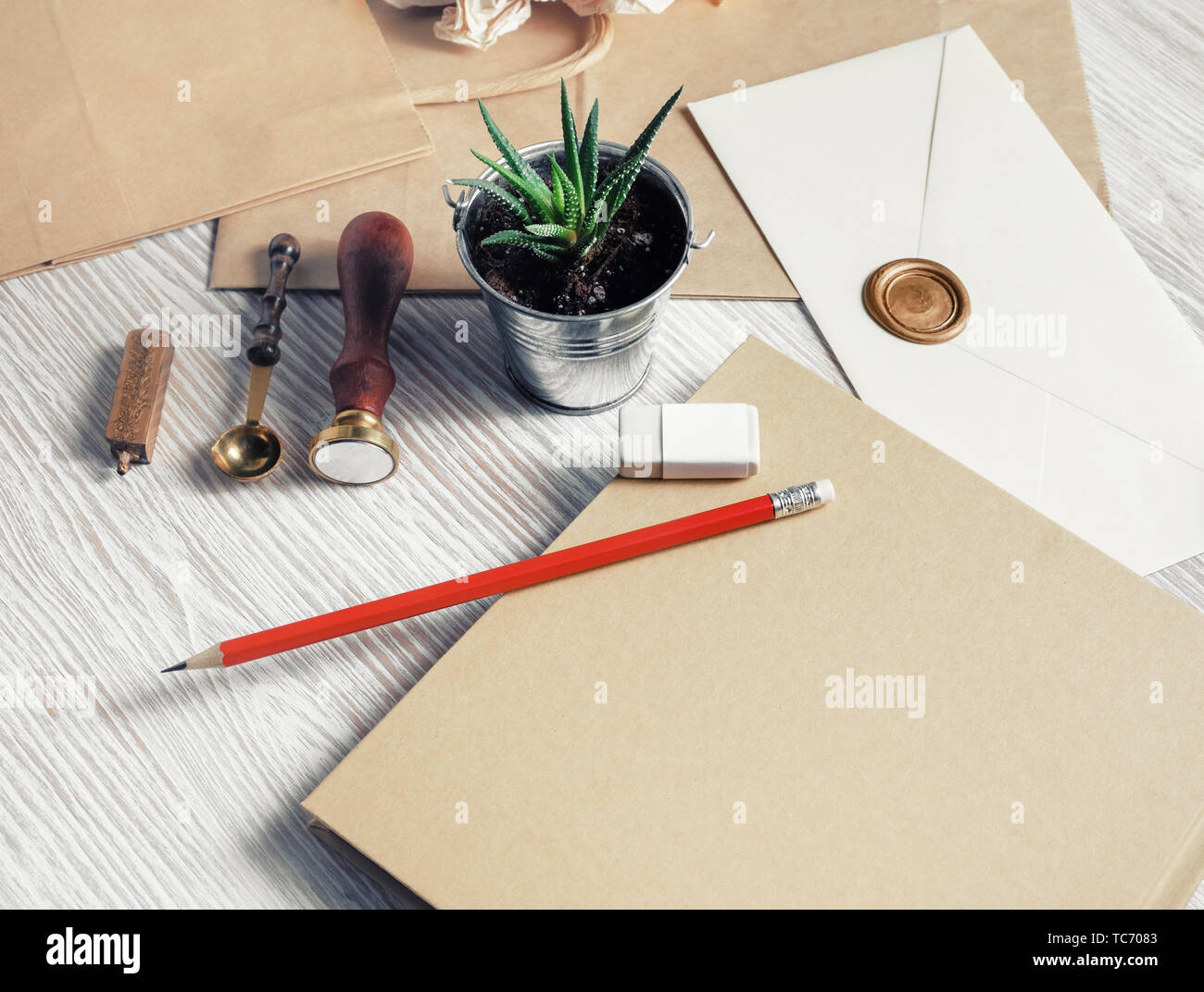 Blank retro stationery set on light wood table background. Mockup for ...