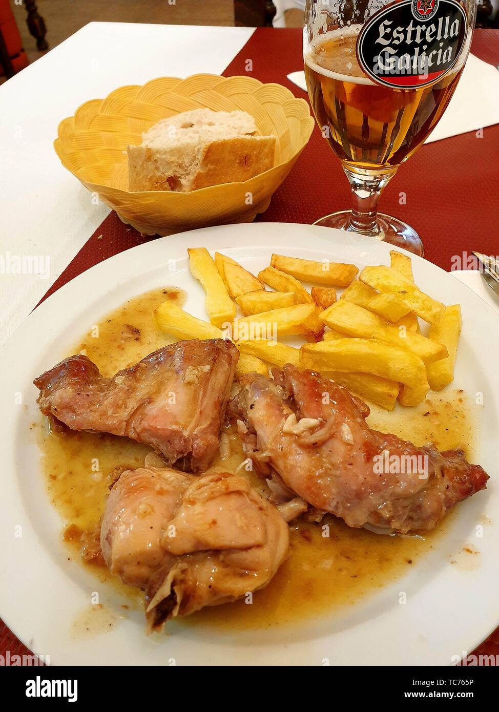 Rabbit stew mediterranean style with french fries Stock Photo - Alamy