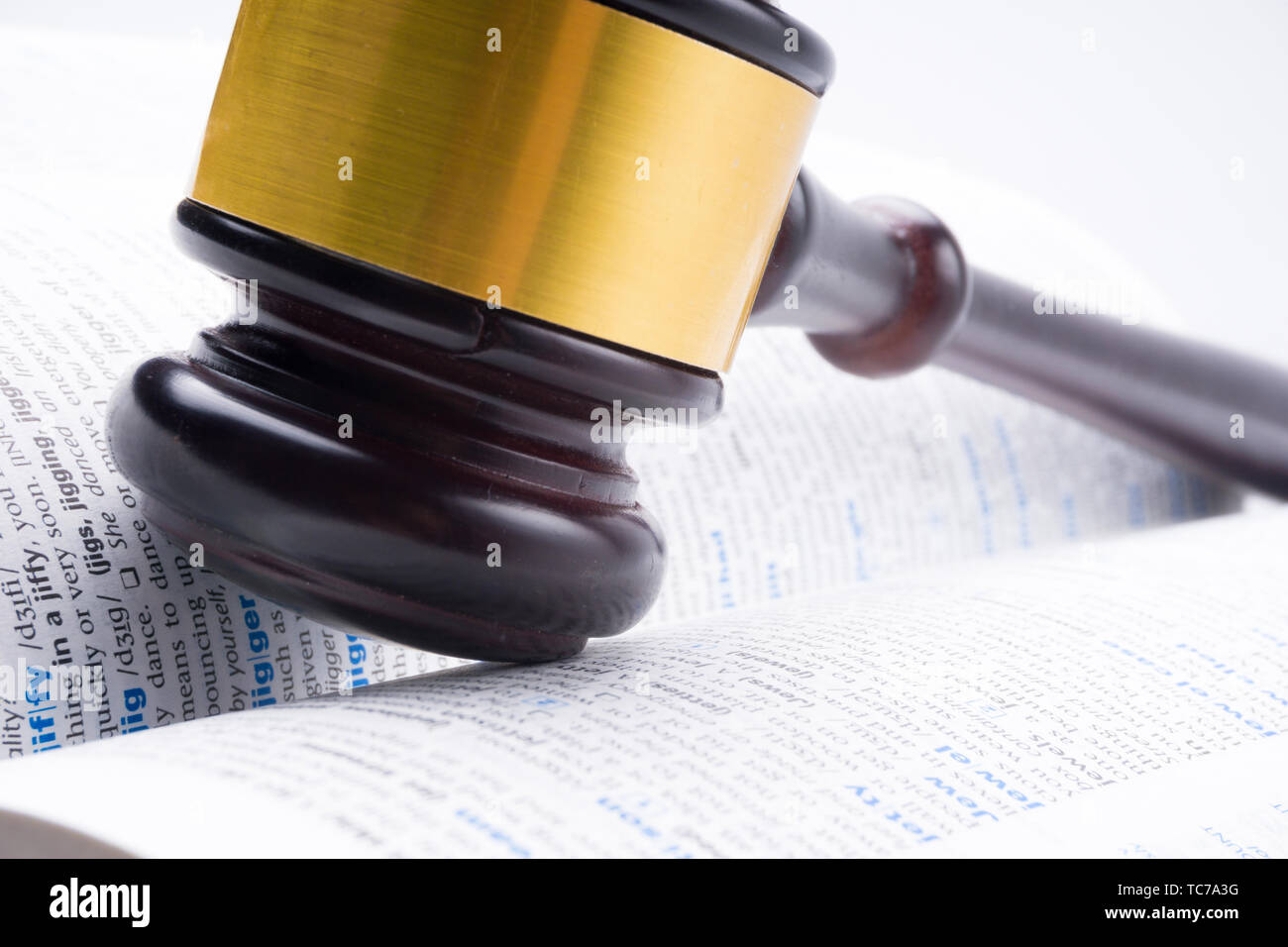 Judge hammer lay on book Stock Photo - Alamy