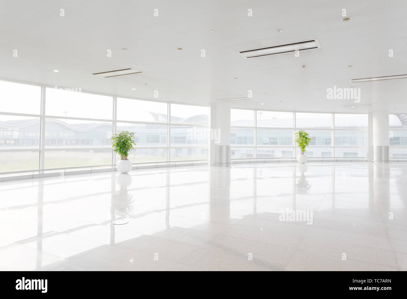 Large window into white office Stock Photo - Alamy