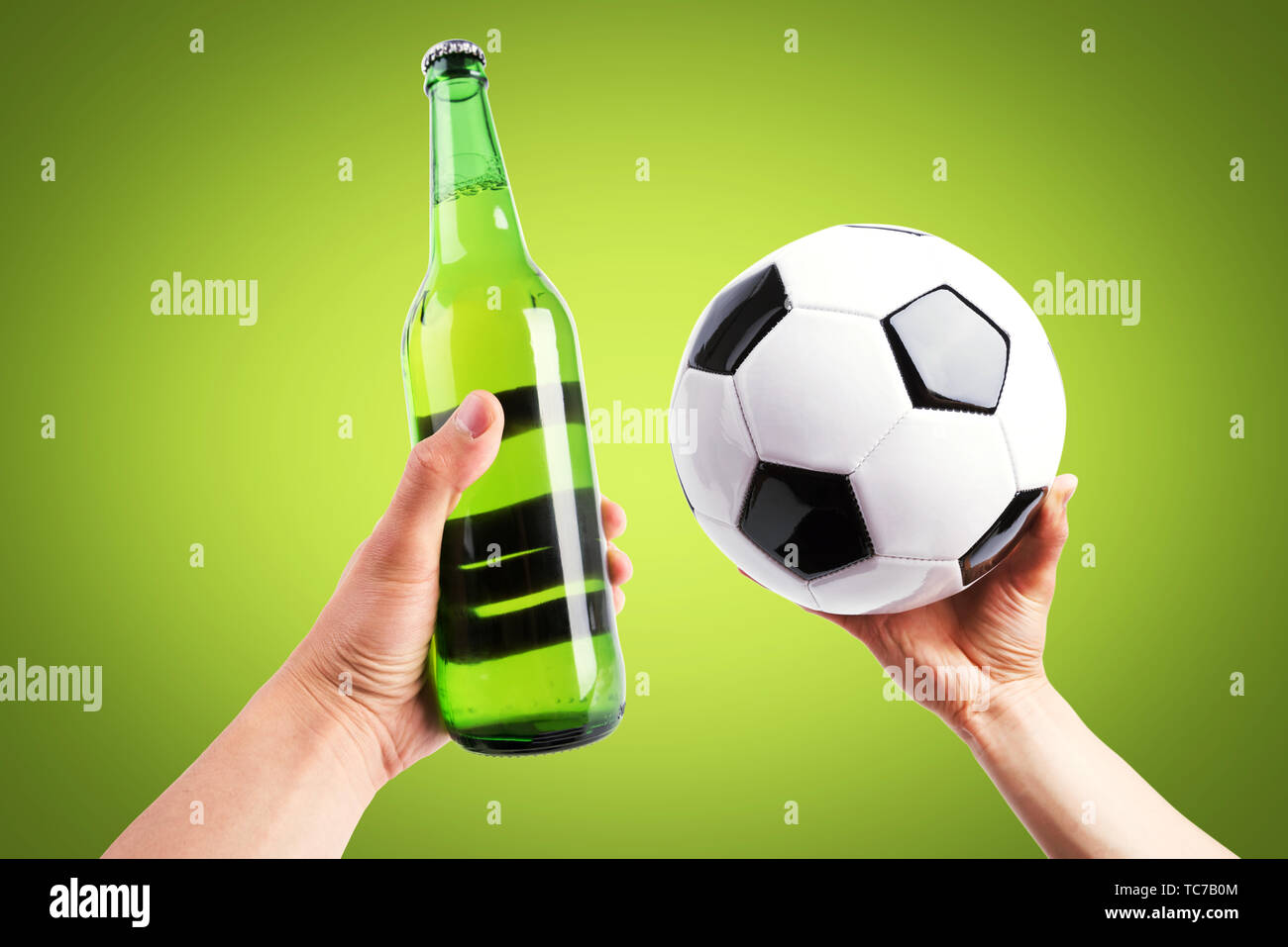 Fresh beer and football on white background Stock Photo - Alamy