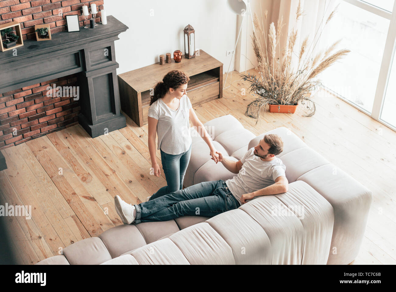 Overhead view of couple holding hands hi-res stock photography and ...