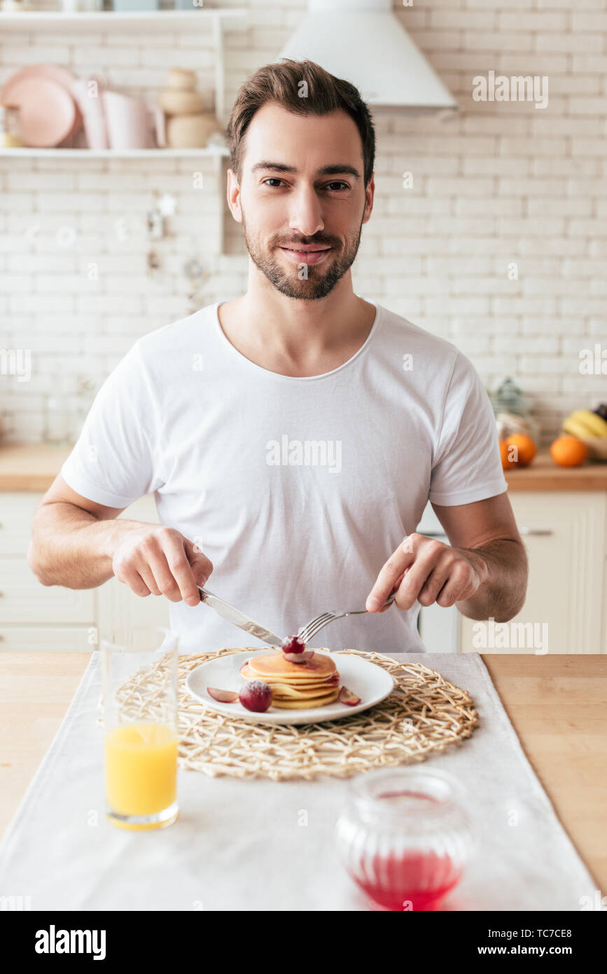 Handsome man eating beard fork hi-res stock photography and images - Alamy