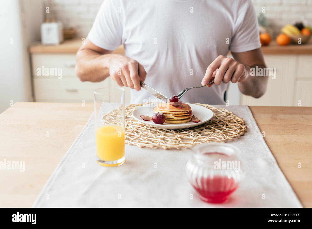 Man eating pancakes hi-res stock photography and images - Alamy