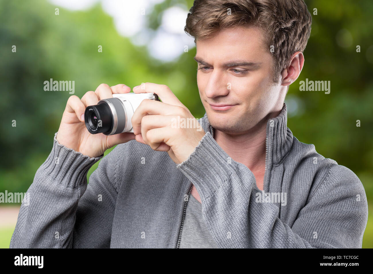 Portrait of young men taking photo Stock Photo - Alamy