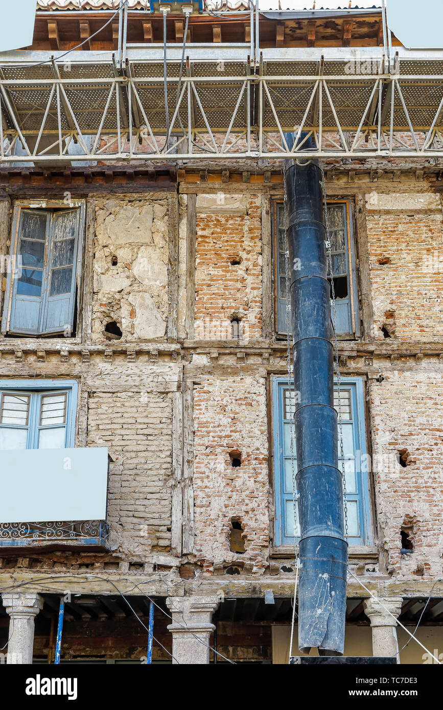 front view of ruined facade of a building in restoration Stock Photo ...