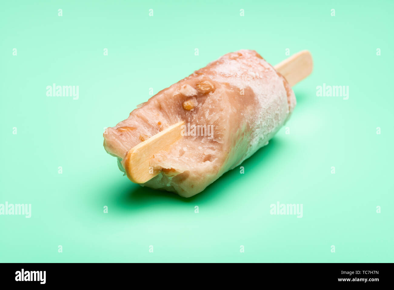 green bean popsicle on a light green background with some bites Stock ...