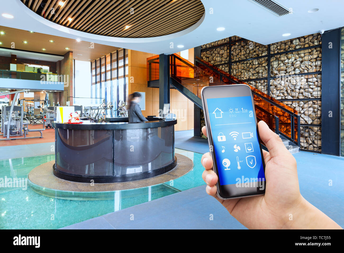 smart phone with smart home with modern lobby Stock Photo - Alamy