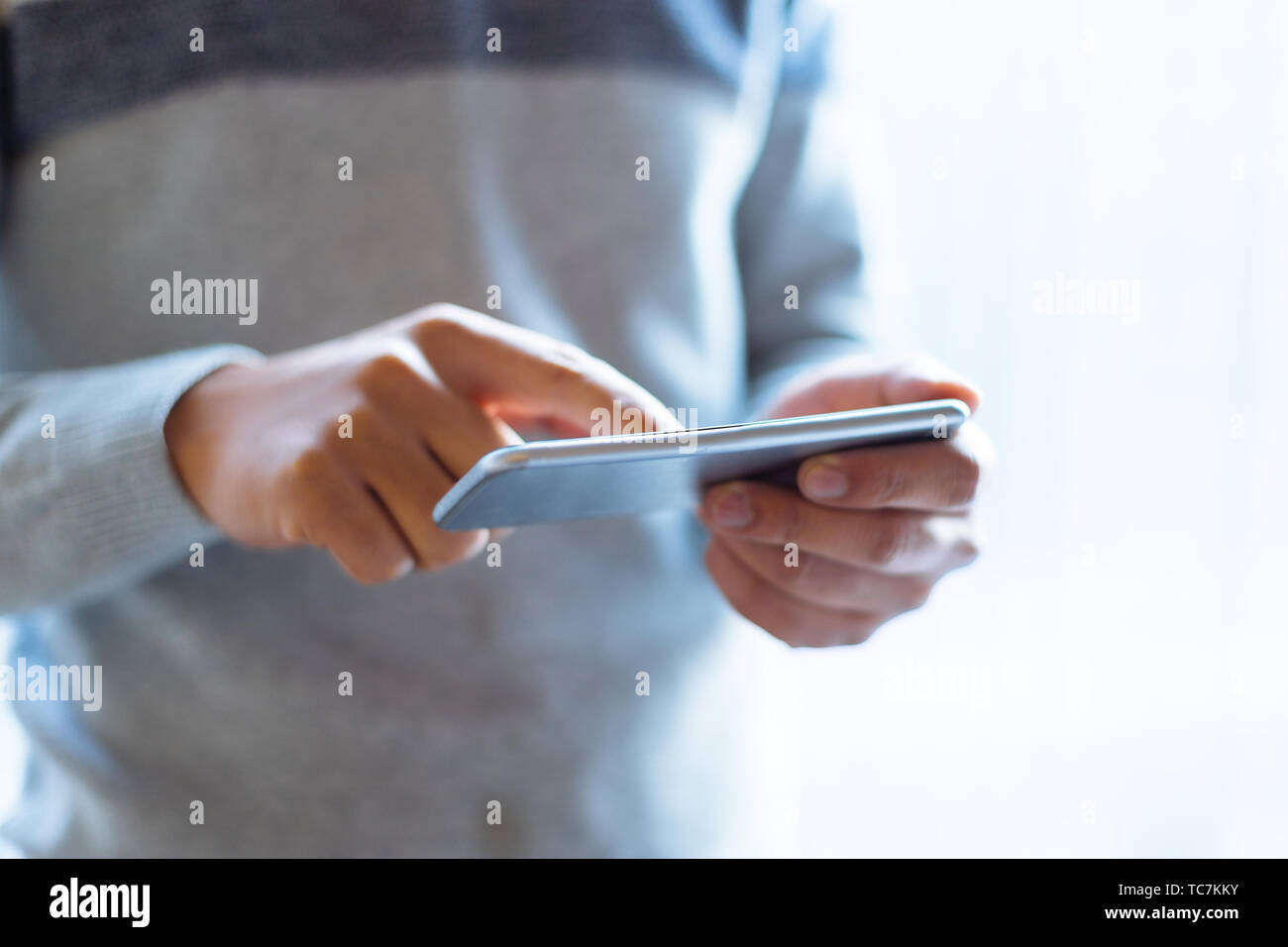 Mobile phone in man's hand Stock Photo - Alamy
