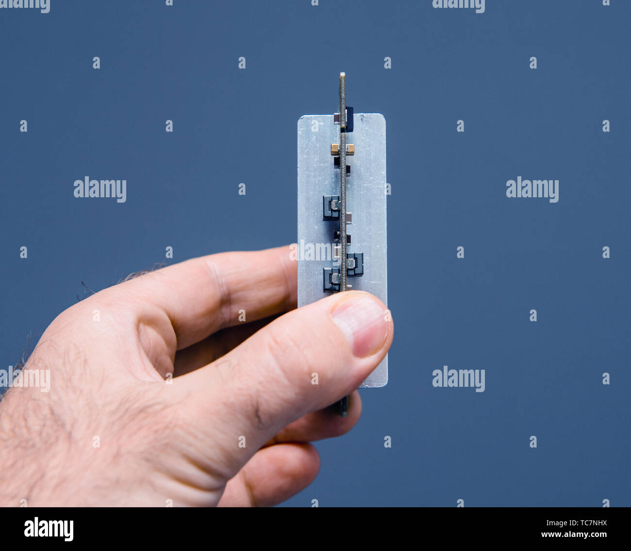 Man hand holding in hand Voltage Regulator Module for powerful server ...