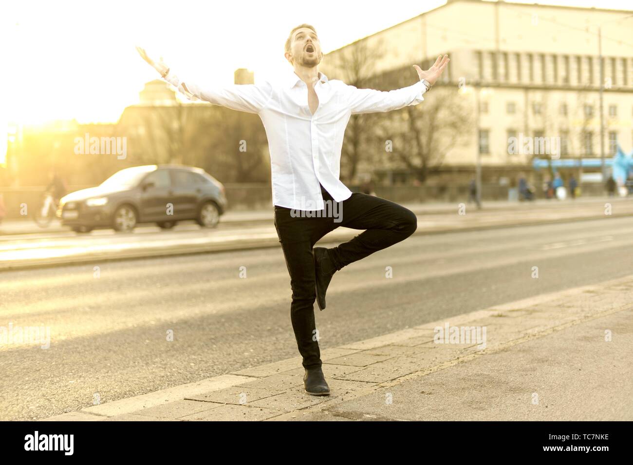 Man balancing on one foot hi-res stock photography and images - Alamy