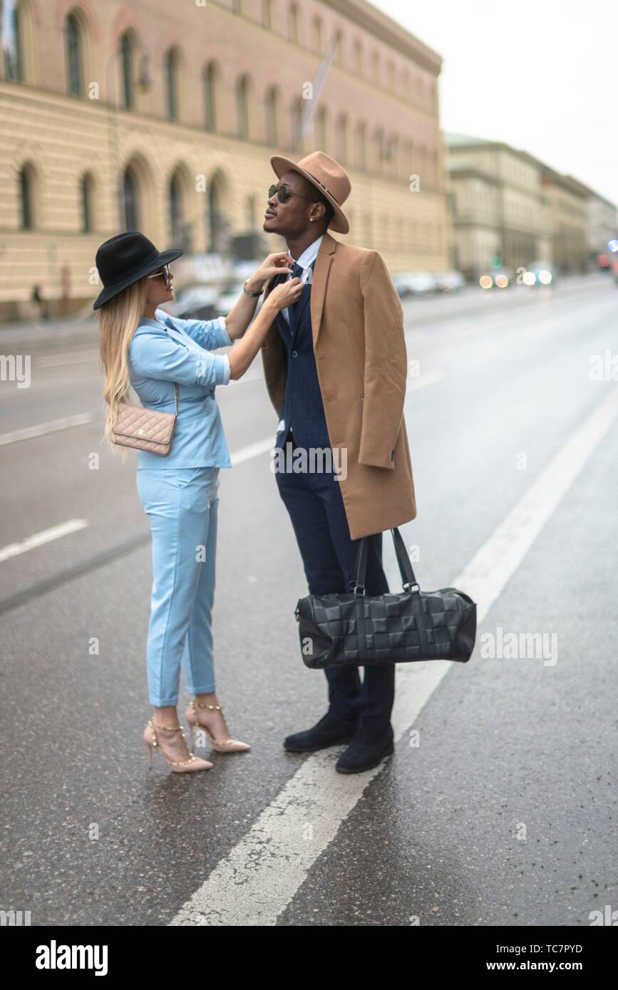 Couple fixing tie hi-res stock photography and images - Alamy