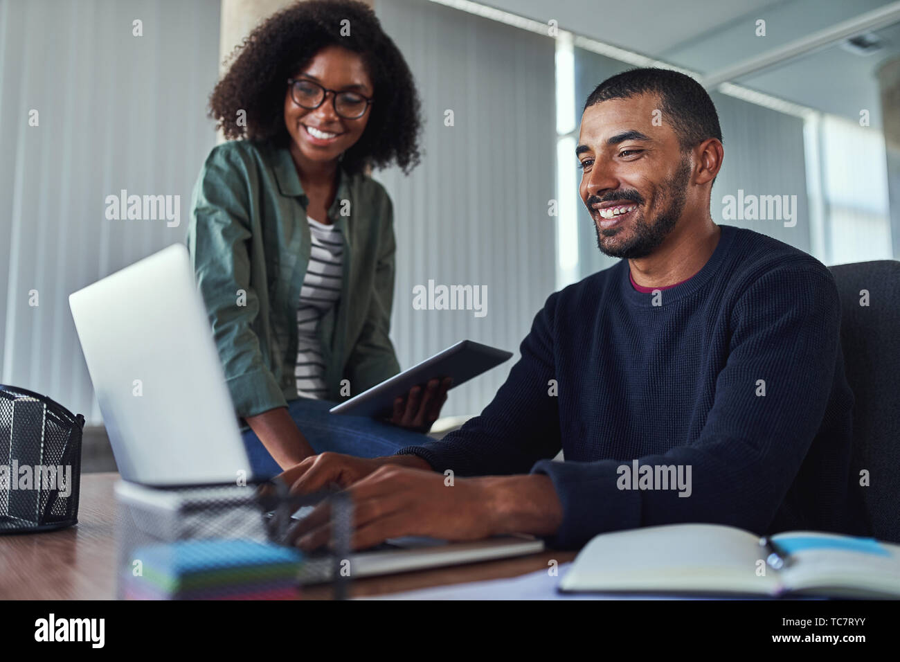 Young colleague hi-res stock photography and images - Alamy