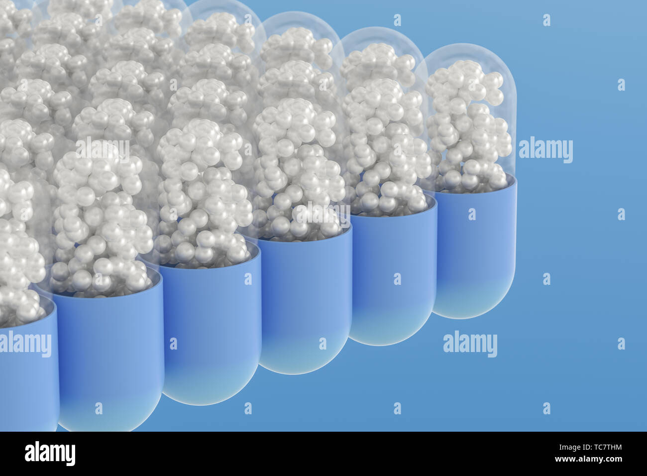 Blue granular capsule, 3-D rendering Stock Photo - Alamy
