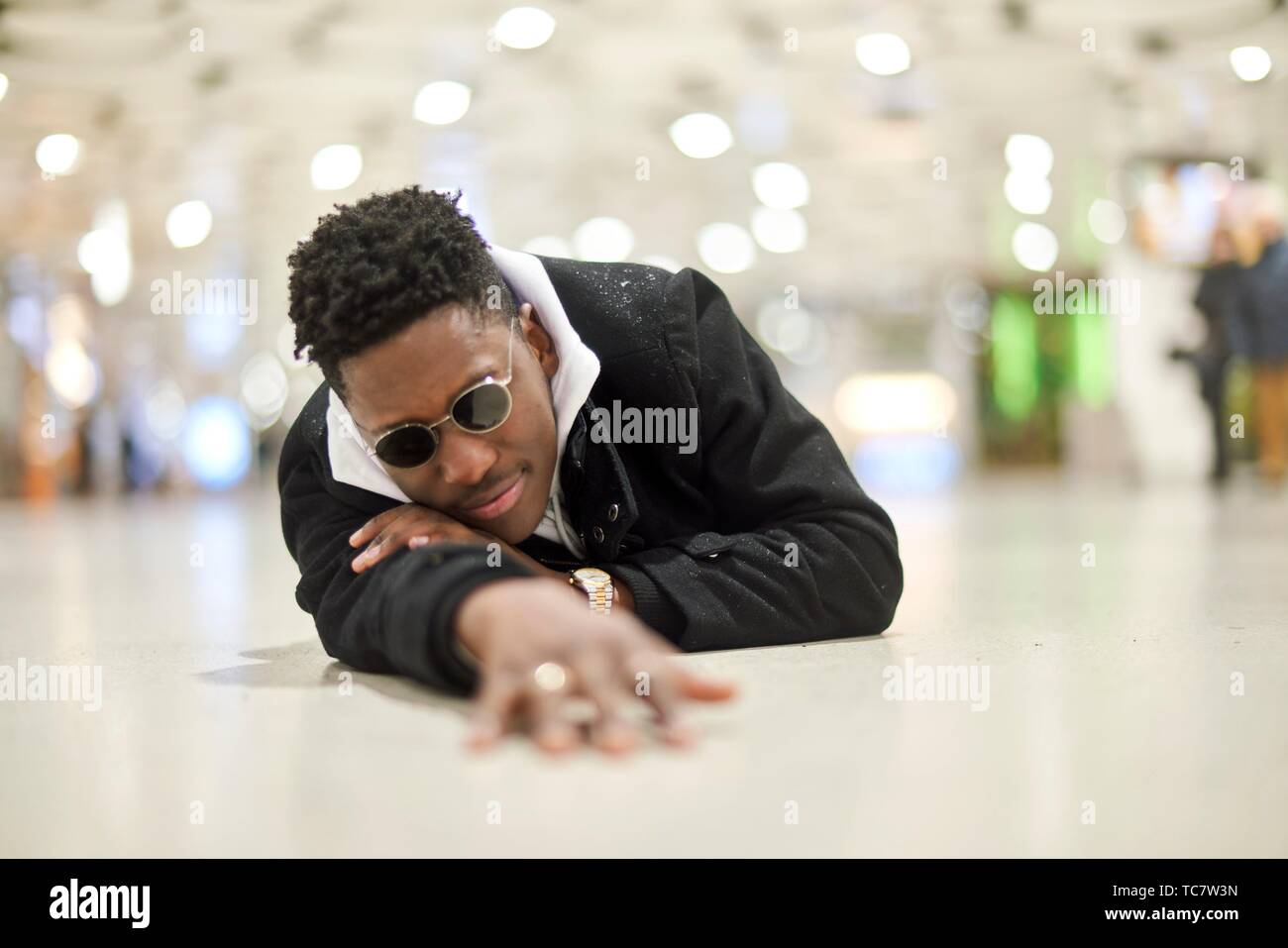 Man laying down on ground hi-res stock photography and images - Alamy