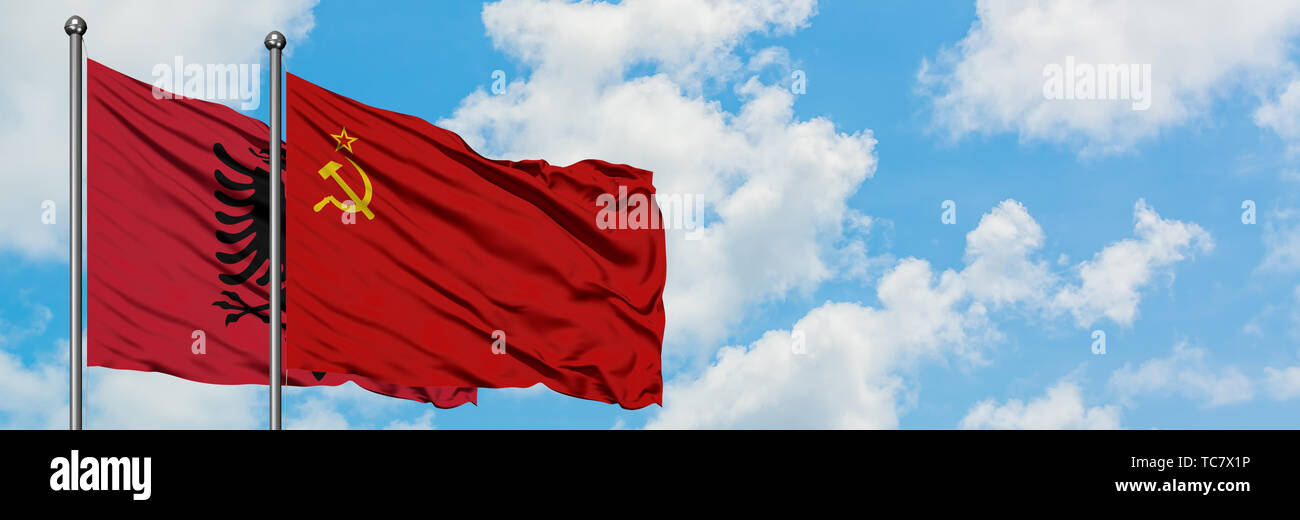 Albania and Soviet Union flag waving in the wind against white cloudy ...