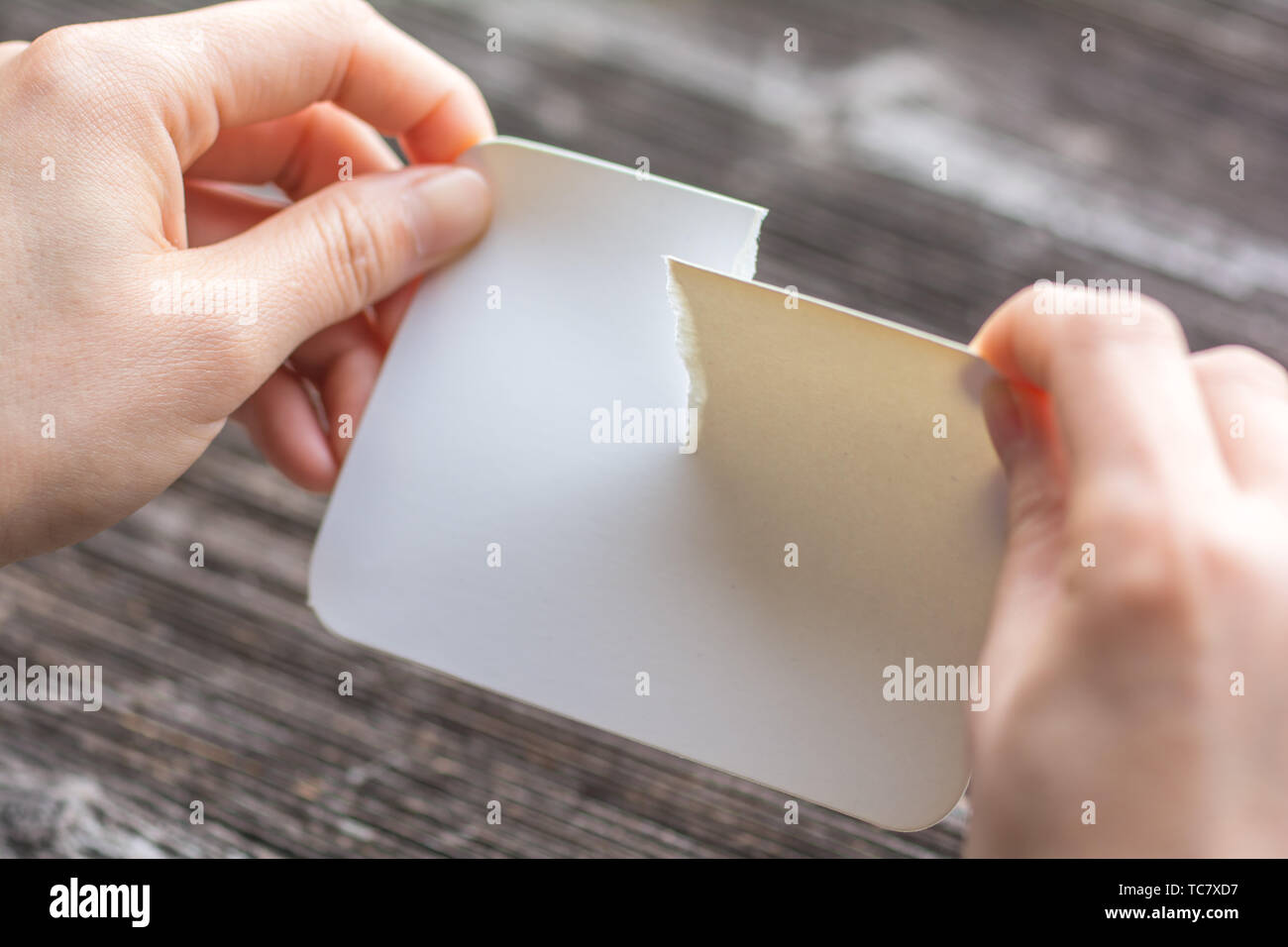 woman tearing the white paper Stock Photo - Alamy