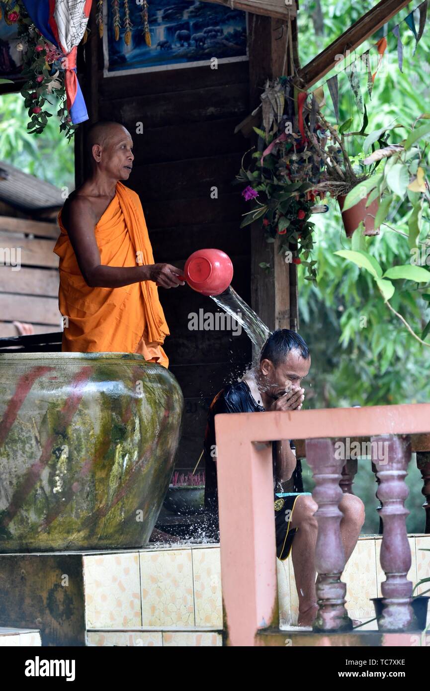 Monk water blessing hi-res stock photography and images - Alamy