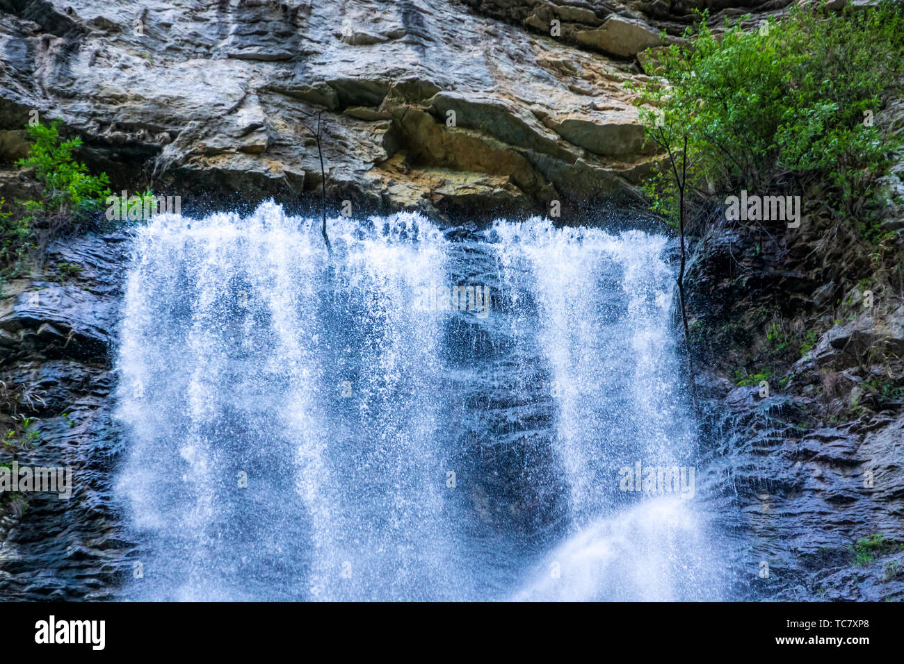 High waterfall falling down from narrow cave in Zhangjiajie in Grand ...