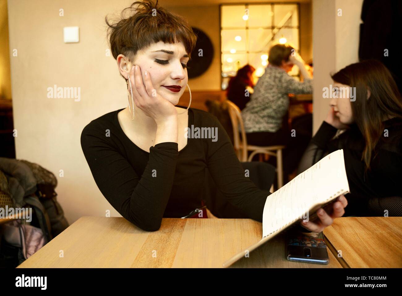 Checking reading menu hi-res stock photography and images - Alamy