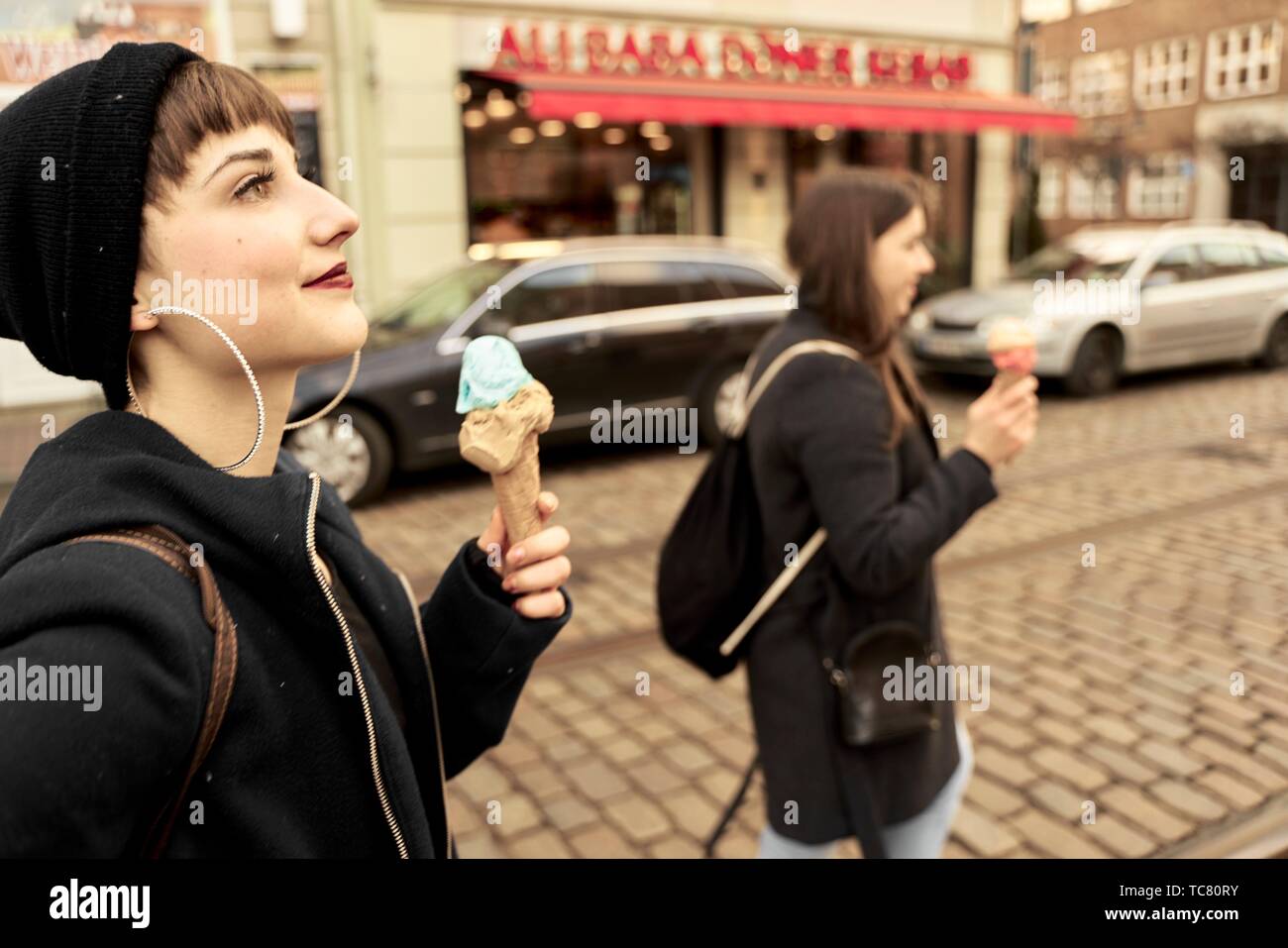 Two Young Women Walking In City With High Resolution Stock Photography ...