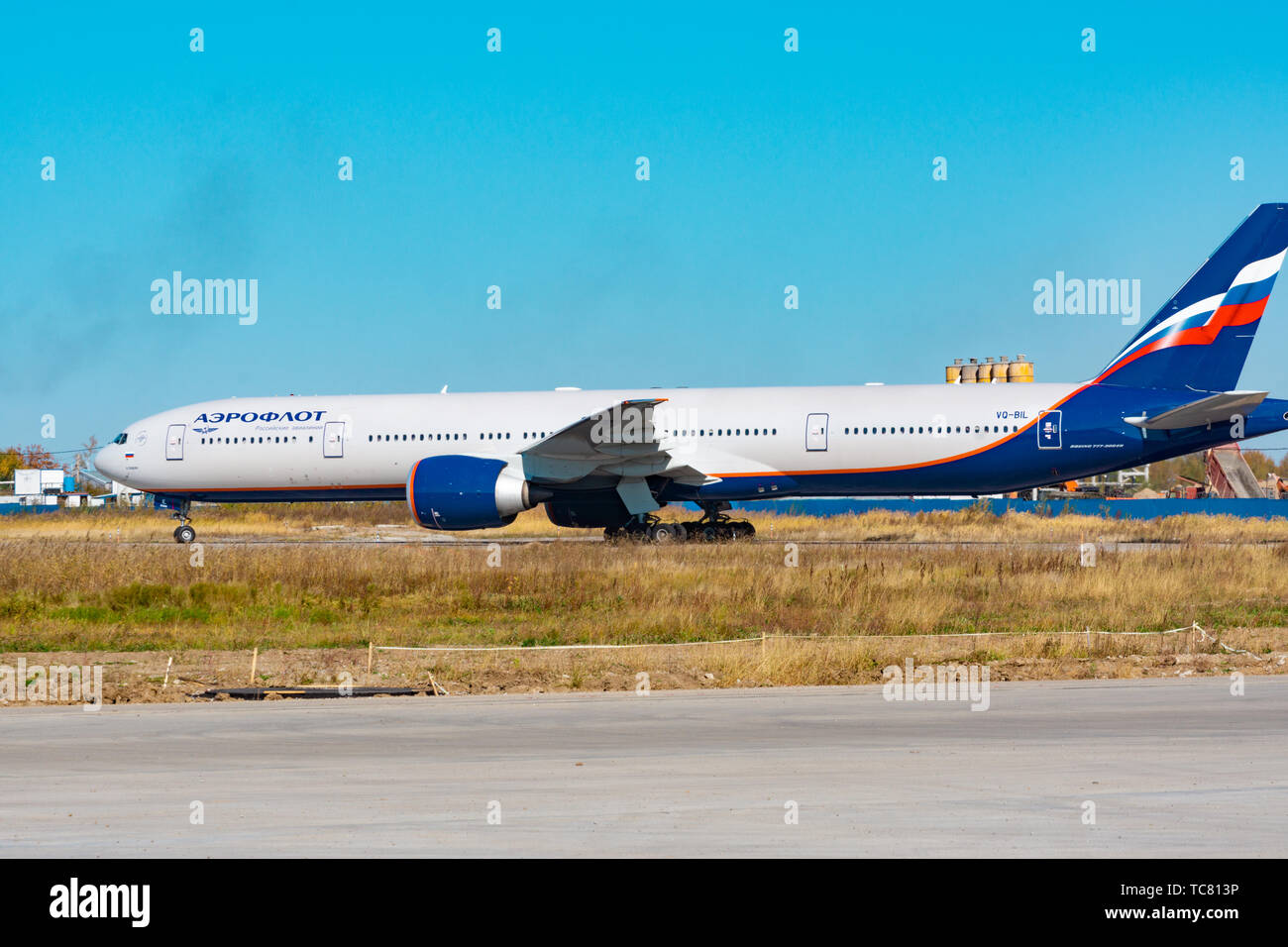 The plane lands on the runway at sunrise at high speed. Airport ...