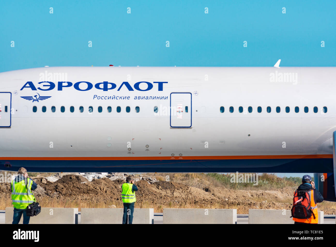 The plane lands on the runway at sunrise at high speed. Airport ...