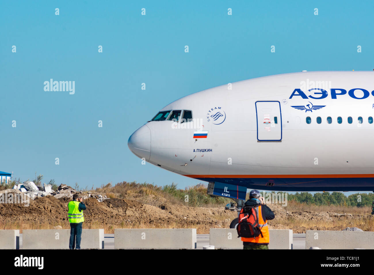The plane lands on the runway at sunrise at high speed. Airport ...