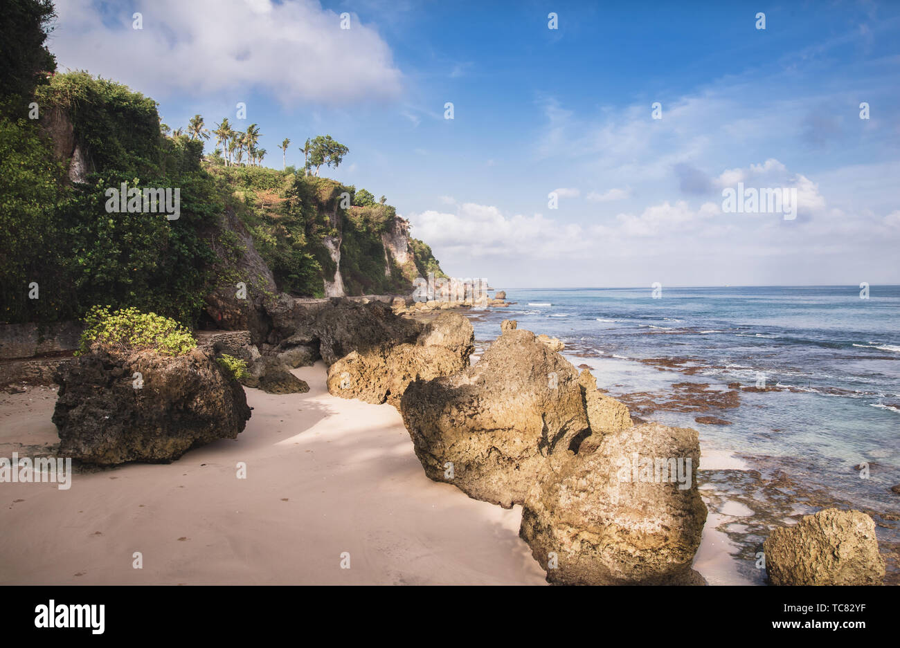 Bali blue sky and white clouds under Indian Ocean resort hotel waves ...